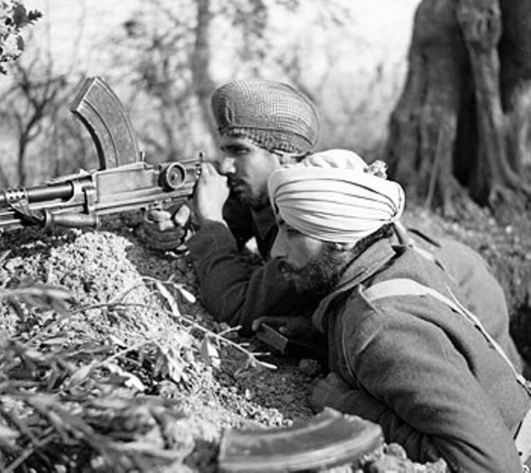 Two Sikh soldiers manoeuvre a Bren light machine gun during the Italian ...